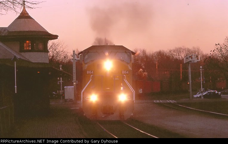 UP 8164 leads a wb coal train past the station.